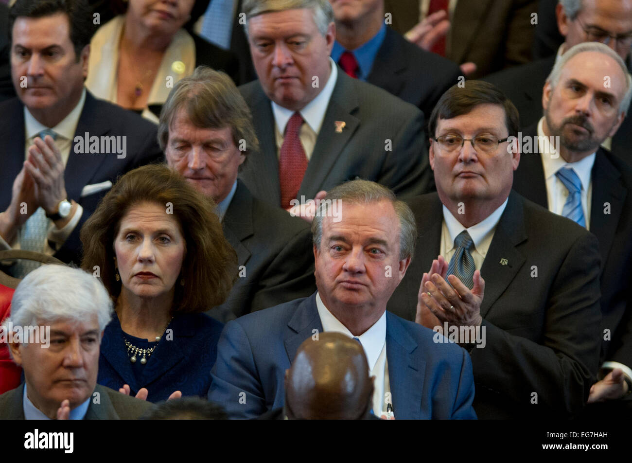 Texas A&M University Chancellor John Sharp (lower center) listens to ...