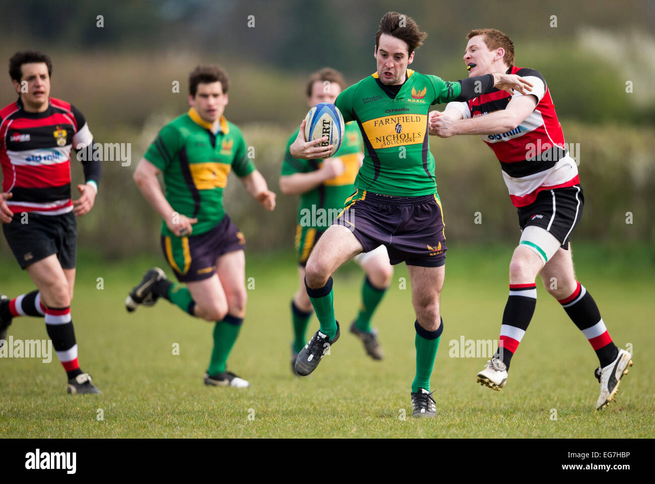 Rugby, player being tackled Stock Photo - Alamy