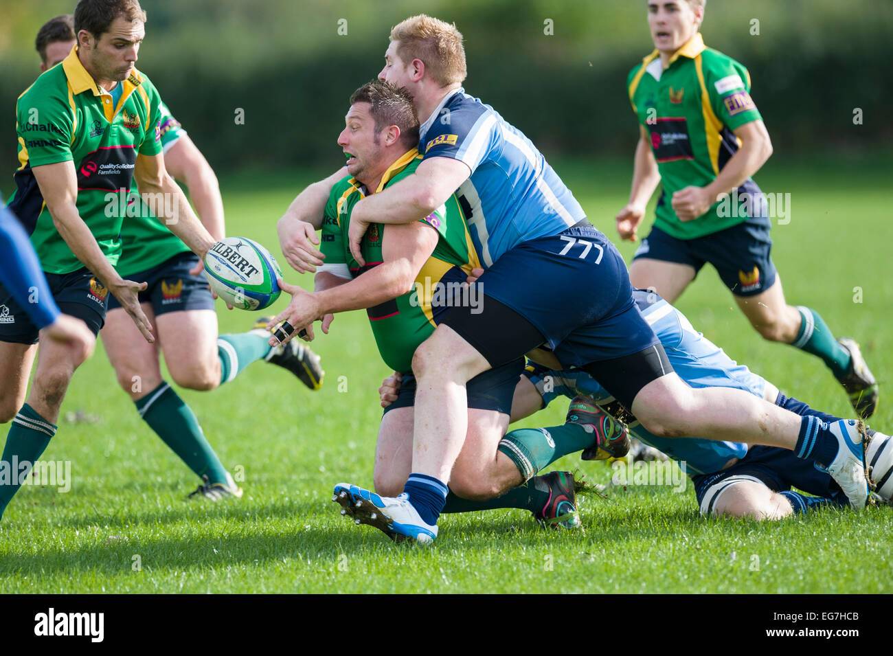 Rugby, player being tackled Stock Photo - Alamy