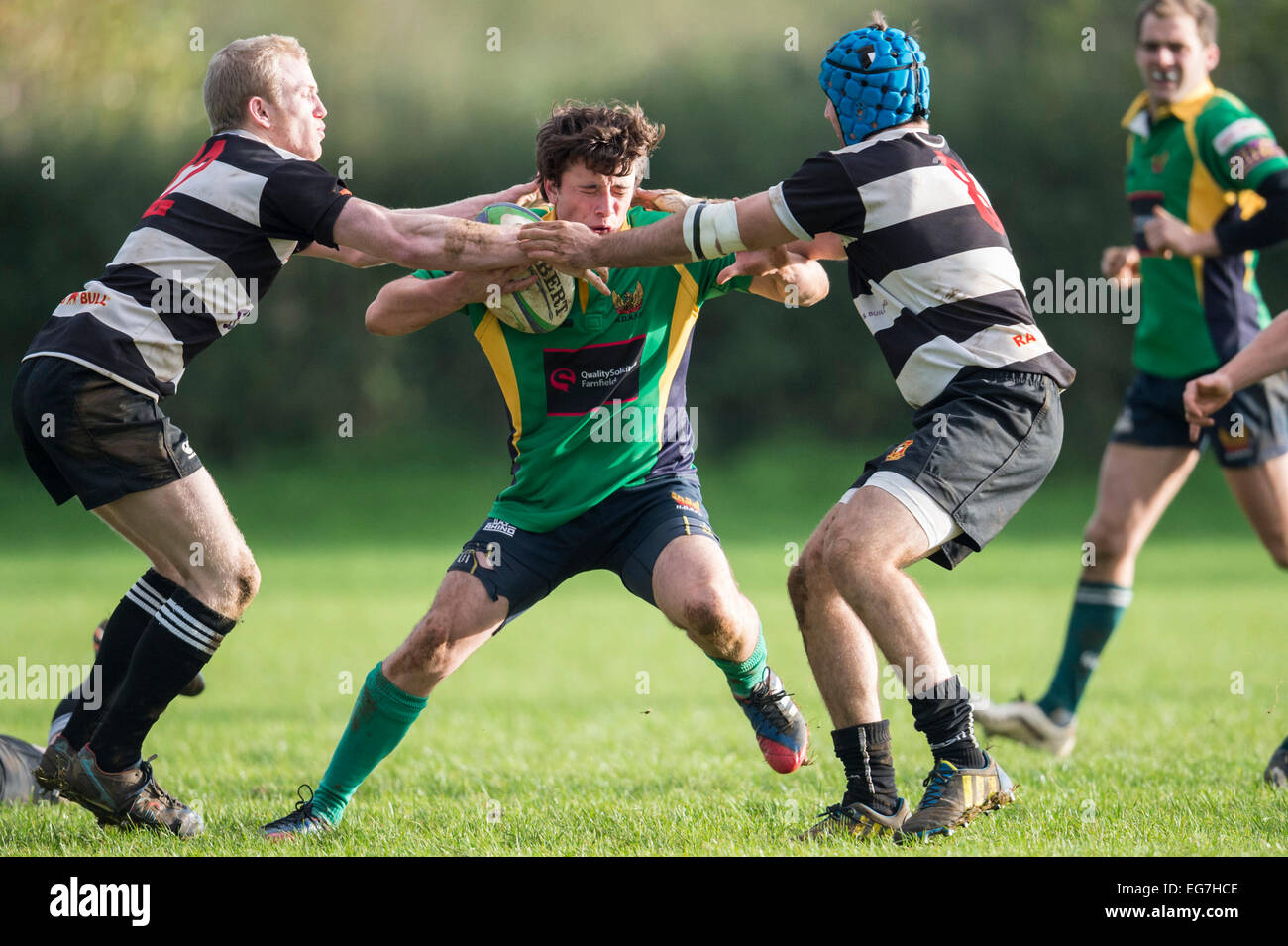 Rugby, player being tackled Stock Photo - Alamy