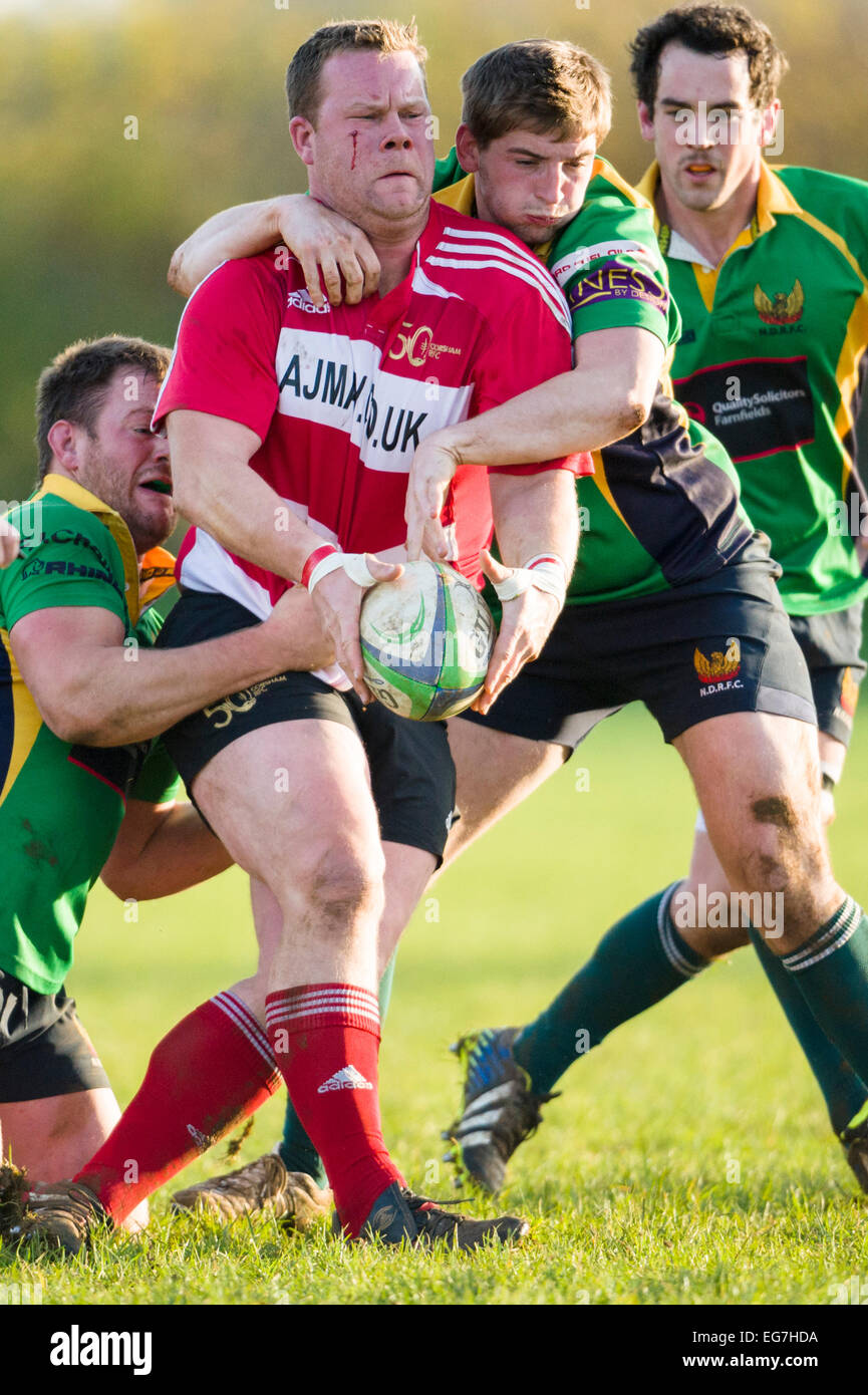 Rugby, player being tackled Stock Photo - Alamy