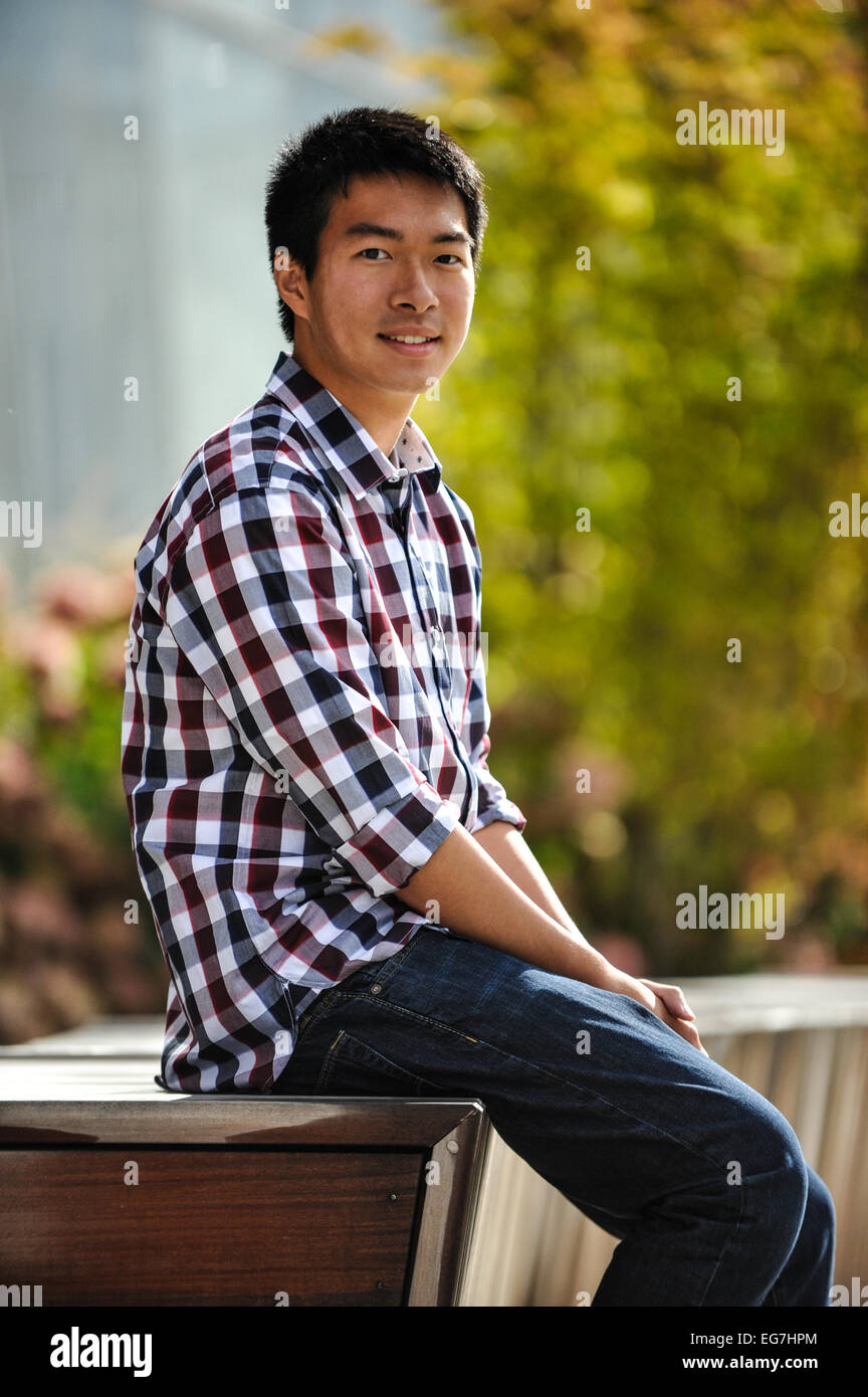 An outdoor portrait of a young and handsome Asian male Stock Photo - Alamy