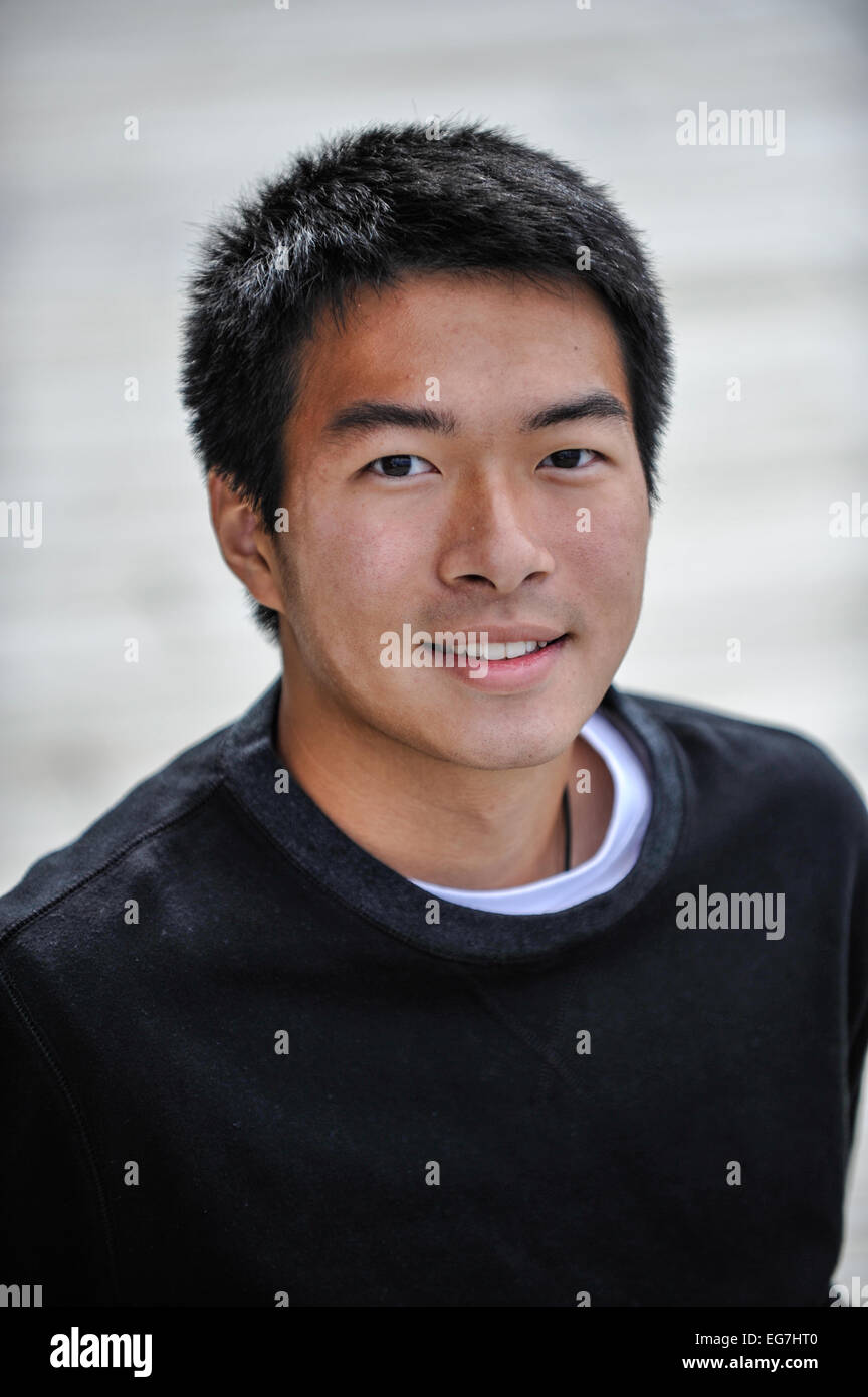An outdoor portrait of a young and handsome Asian male Stock Photo - Alamy