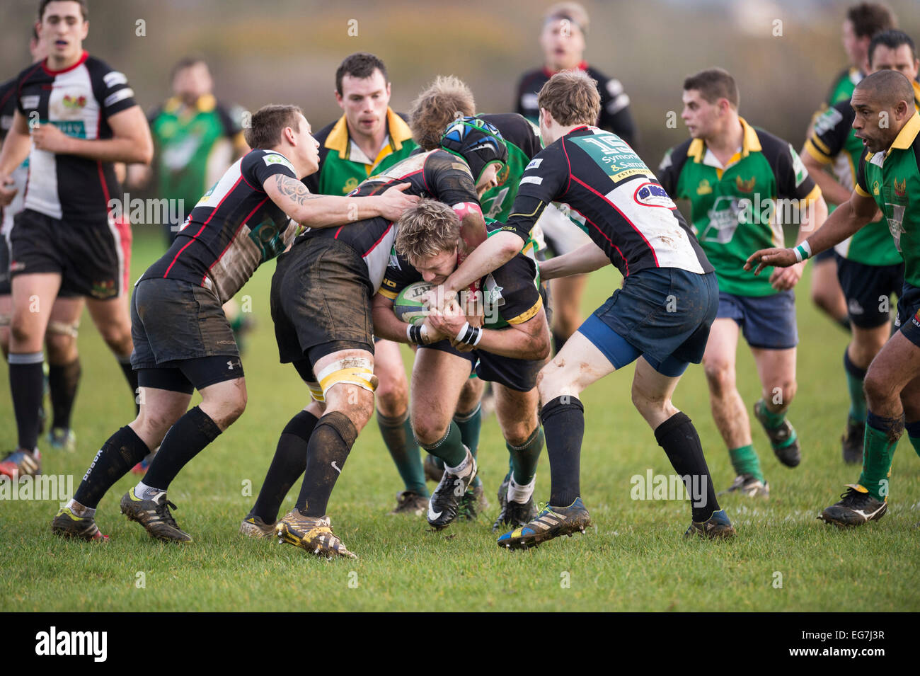 Rugby, player being tackled Stock Photo - Alamy