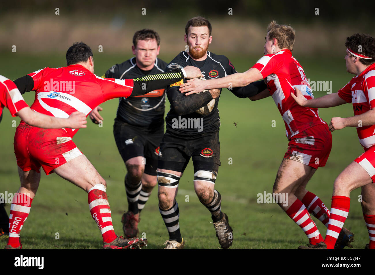 Rugby, player being tackled Stock Photo - Alamy