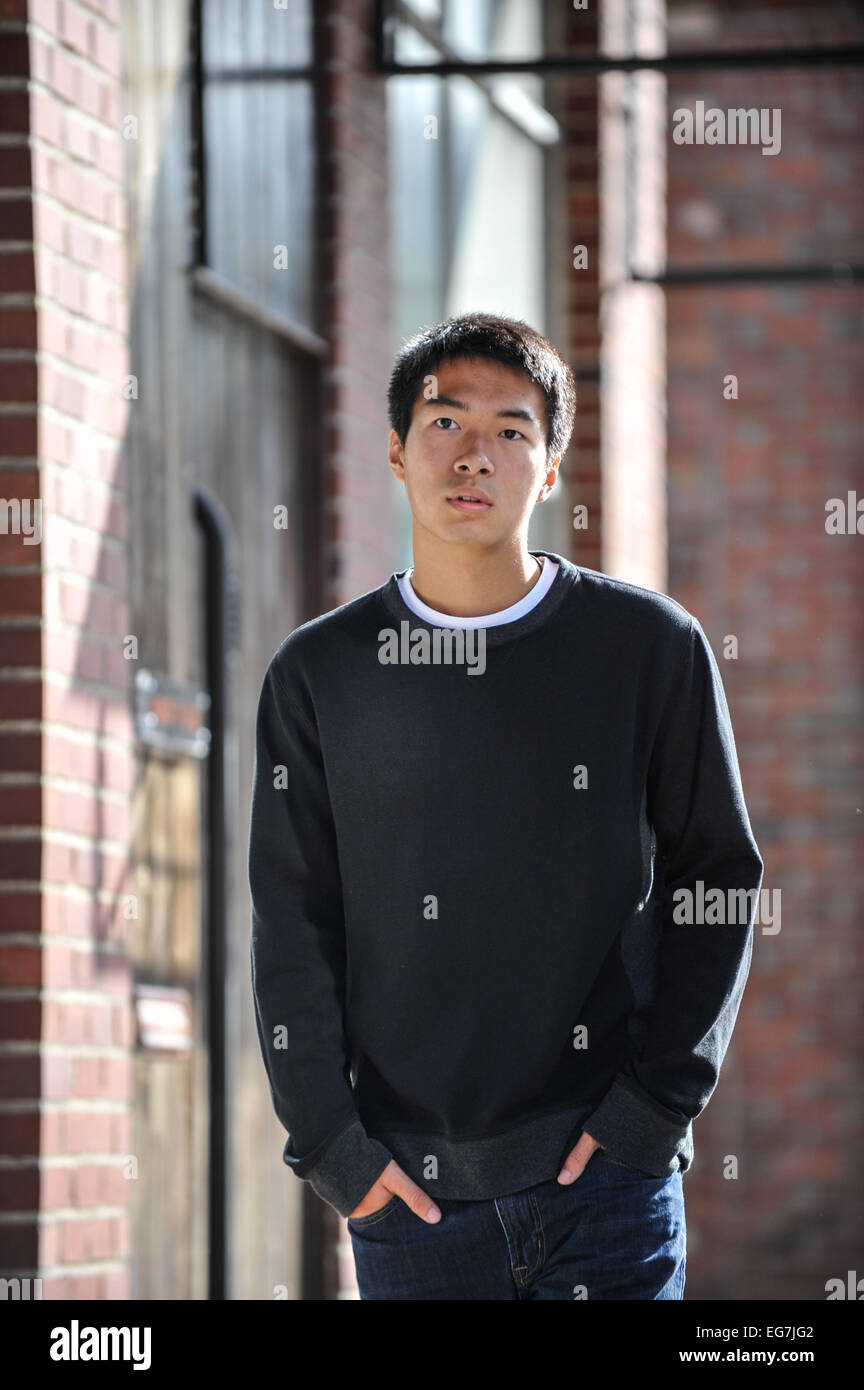An outdoor portrait of a young and handsome Asian male Stock Photo - Alamy