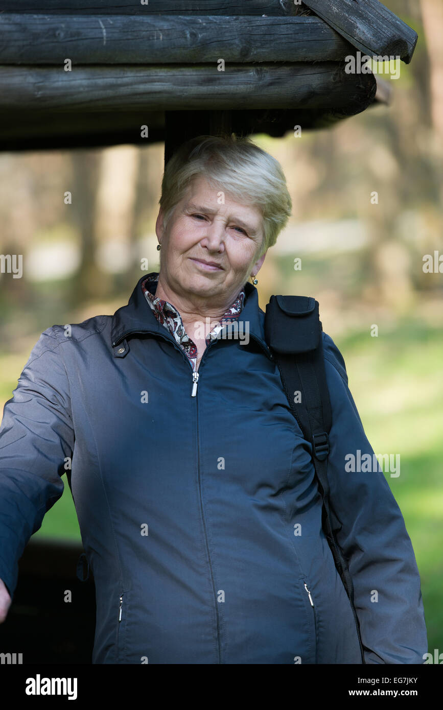 Senior woman standing outside hi-res stock photography and images - Alamy