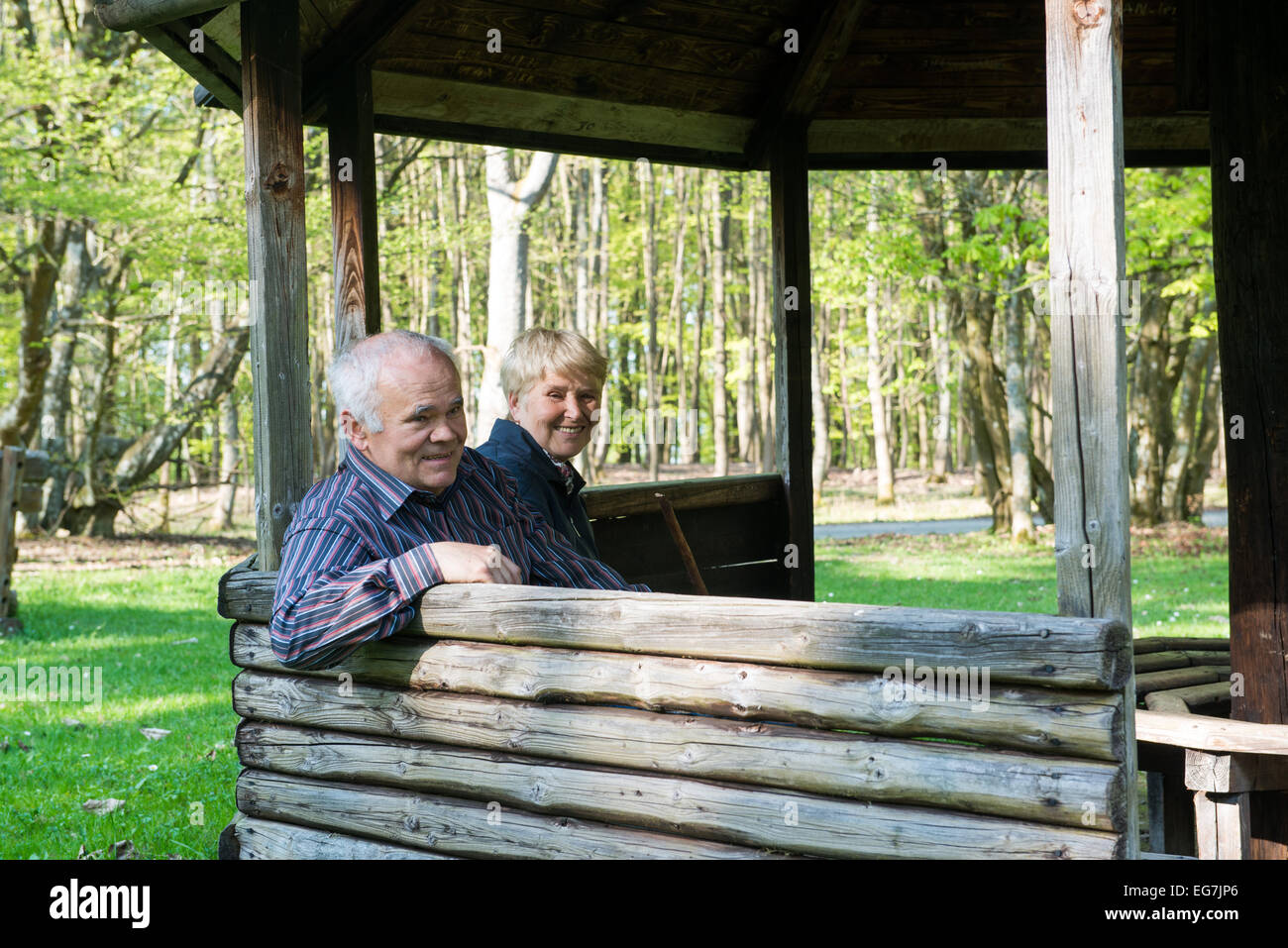 Older people sitting in the arbor on the forest and relax Stock Photo ...