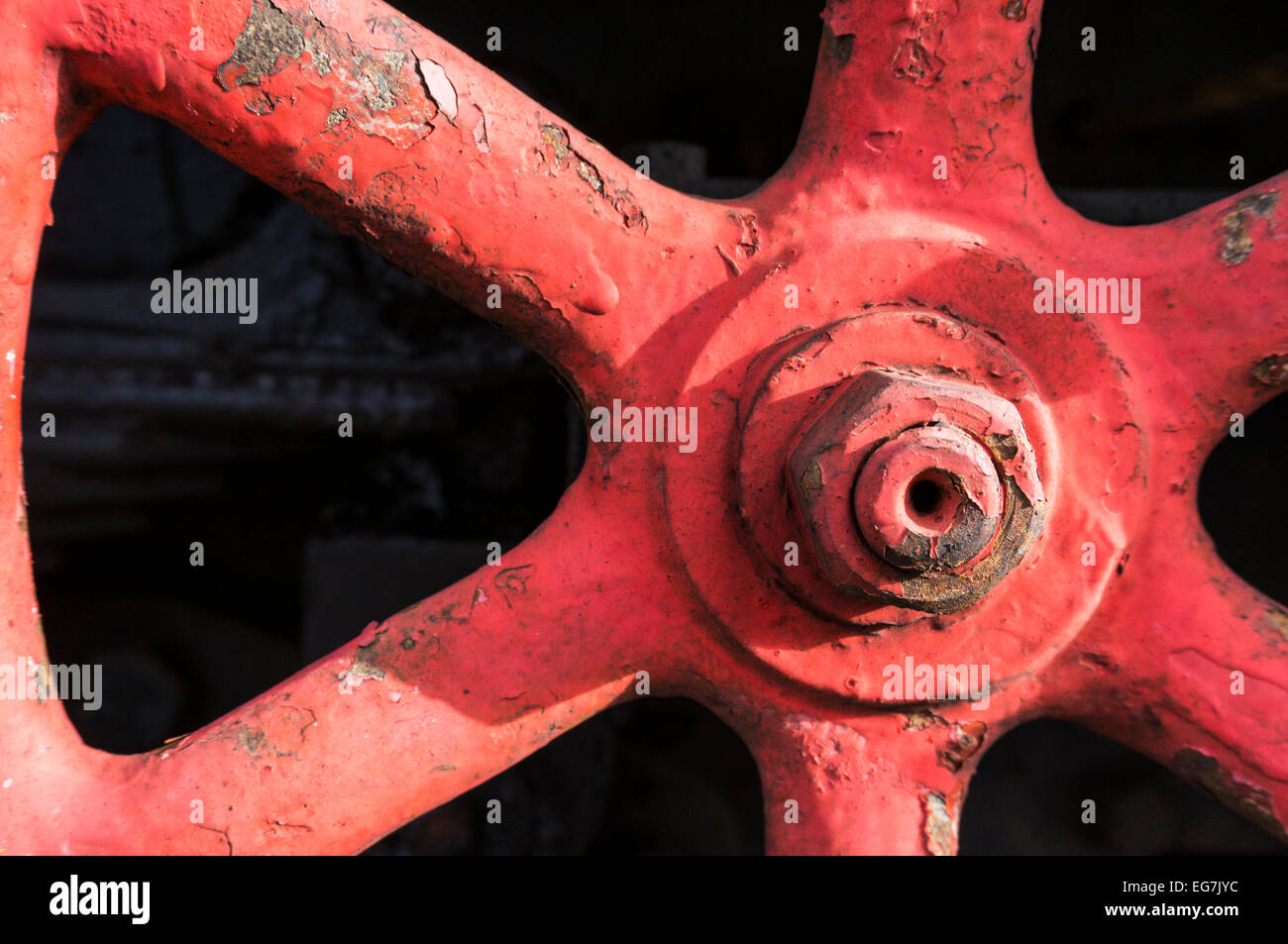 Abstract close up view of a spoked red hand wheel Stock Photo - Alamy