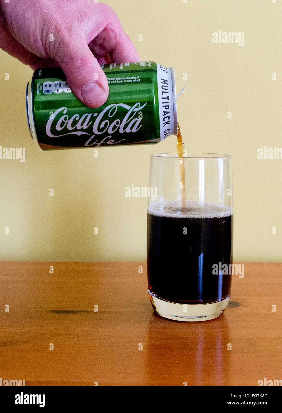 Caucasian Man Pouring a Coca-Cola Life Soft Drink Into A Glass MODEL ...