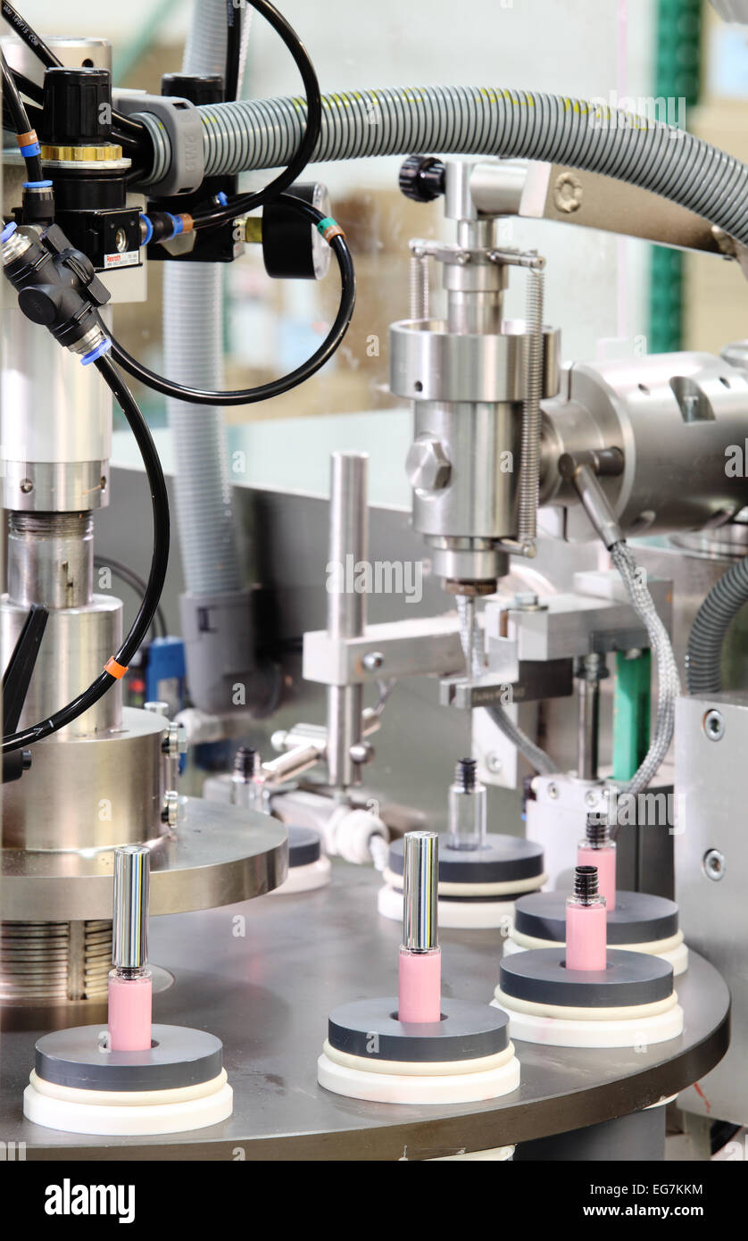 A vial filling machine in a cosmetics factory Stock Photo - Alamy