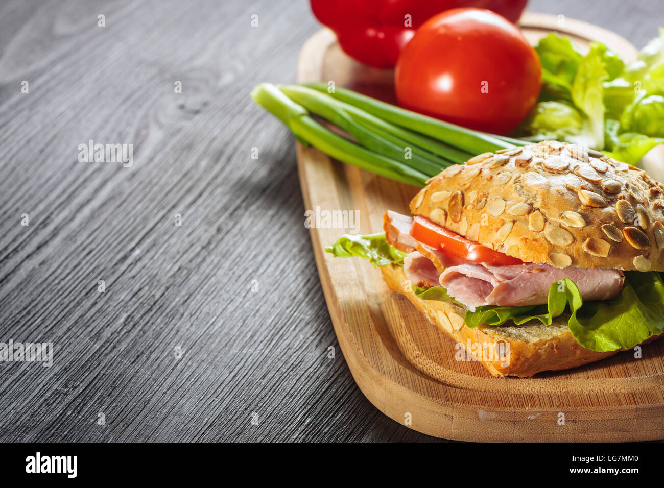 A fresh deli sandwich with ham, radish, tomatoes Stock Photo - Alamy