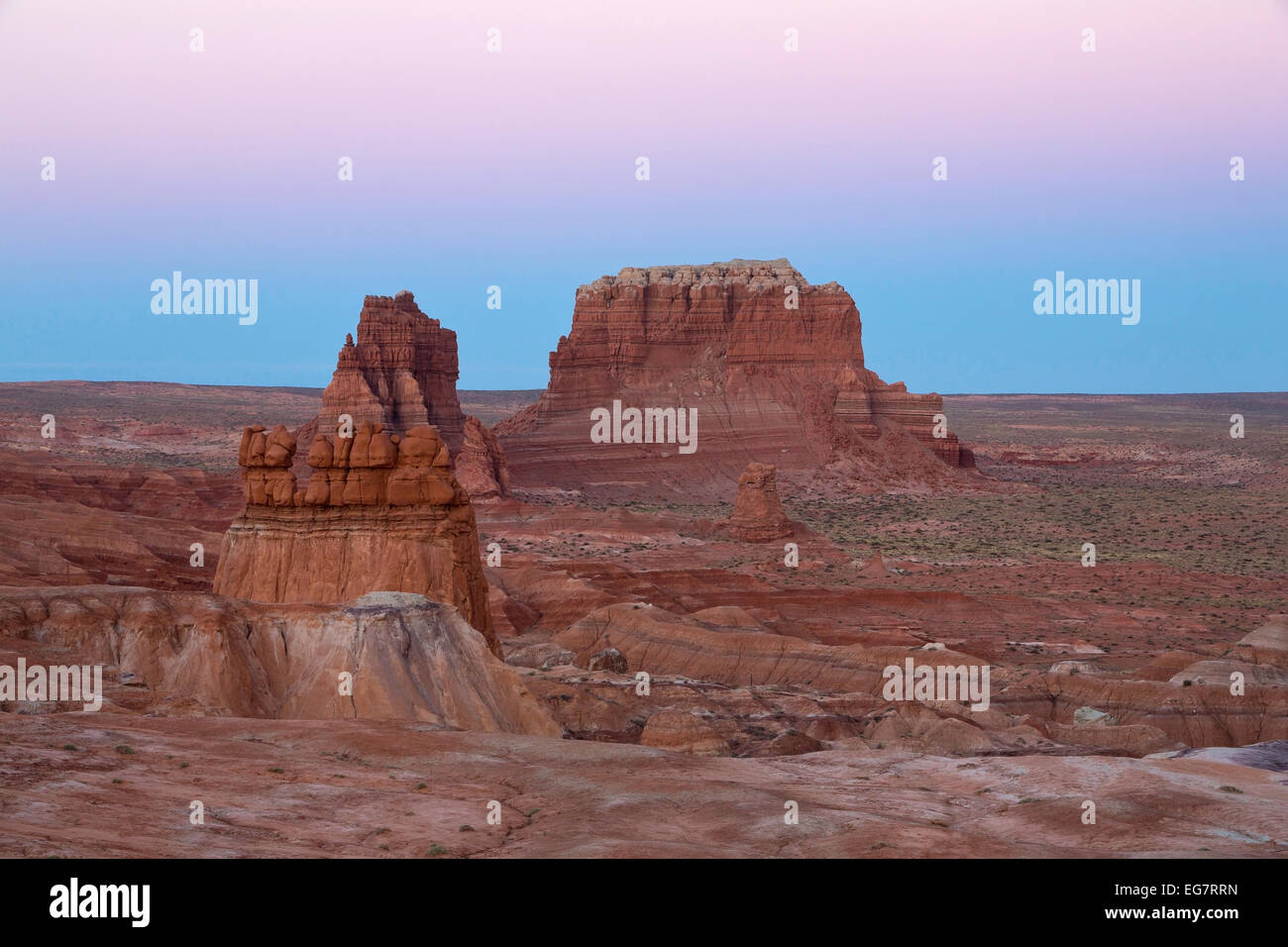 The earth shadow rises over Goblin Valley State Park in Utah at dusk ...