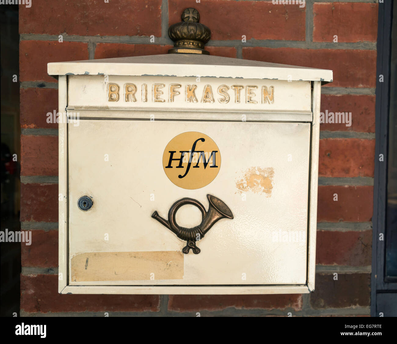 Old mailbox on a red brick wall of a medieval building in Lubeck ...