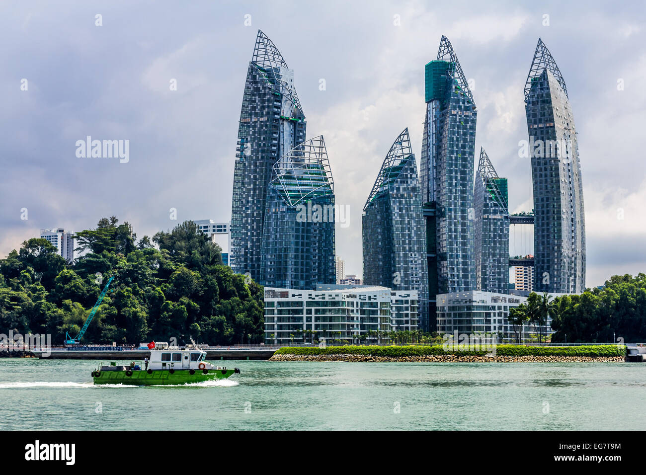 A boat passes modern skyscrapers in Singapore Stock Photo - Alamy