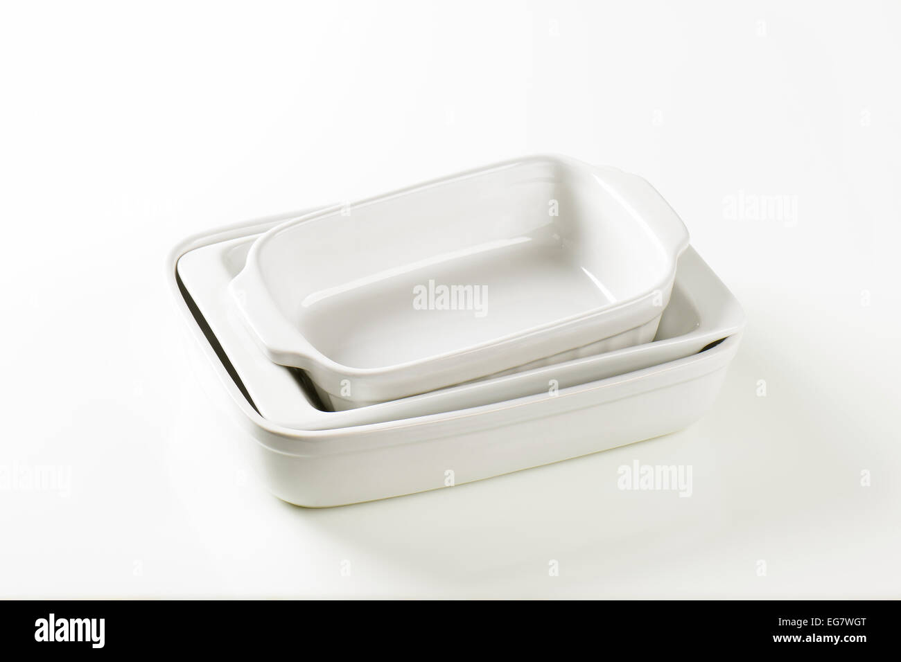 Three rectangular white porcelain baking dishes Stock Photo - Alamy