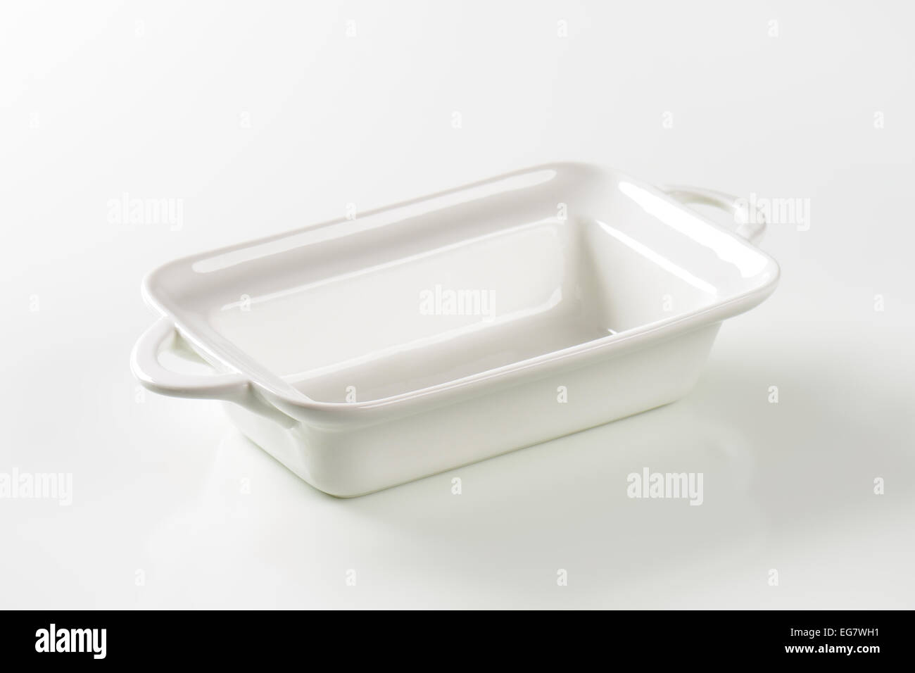 Deep rectangular white ceramic dish with handles Stock Photo - Alamy