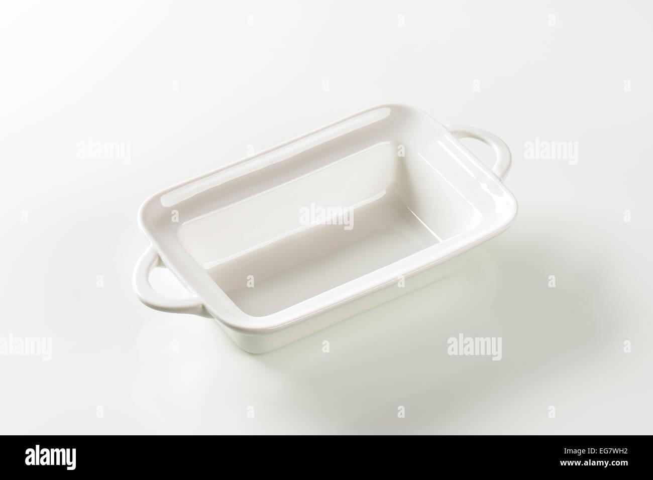 Deep rectangular white ceramic dish with handles Stock Photo - Alamy