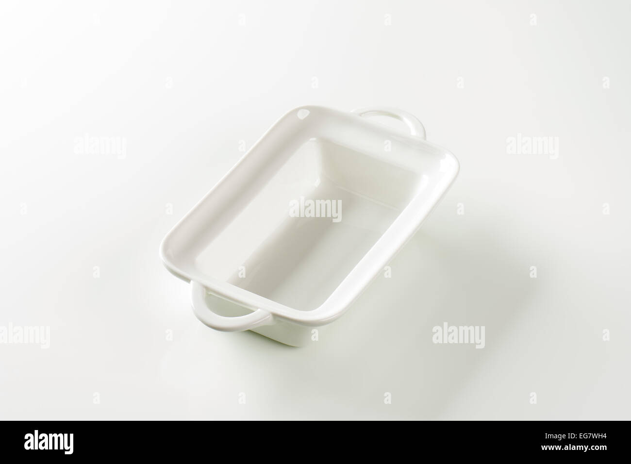 Deep rectangular white ceramic dish with handles Stock Photo - Alamy