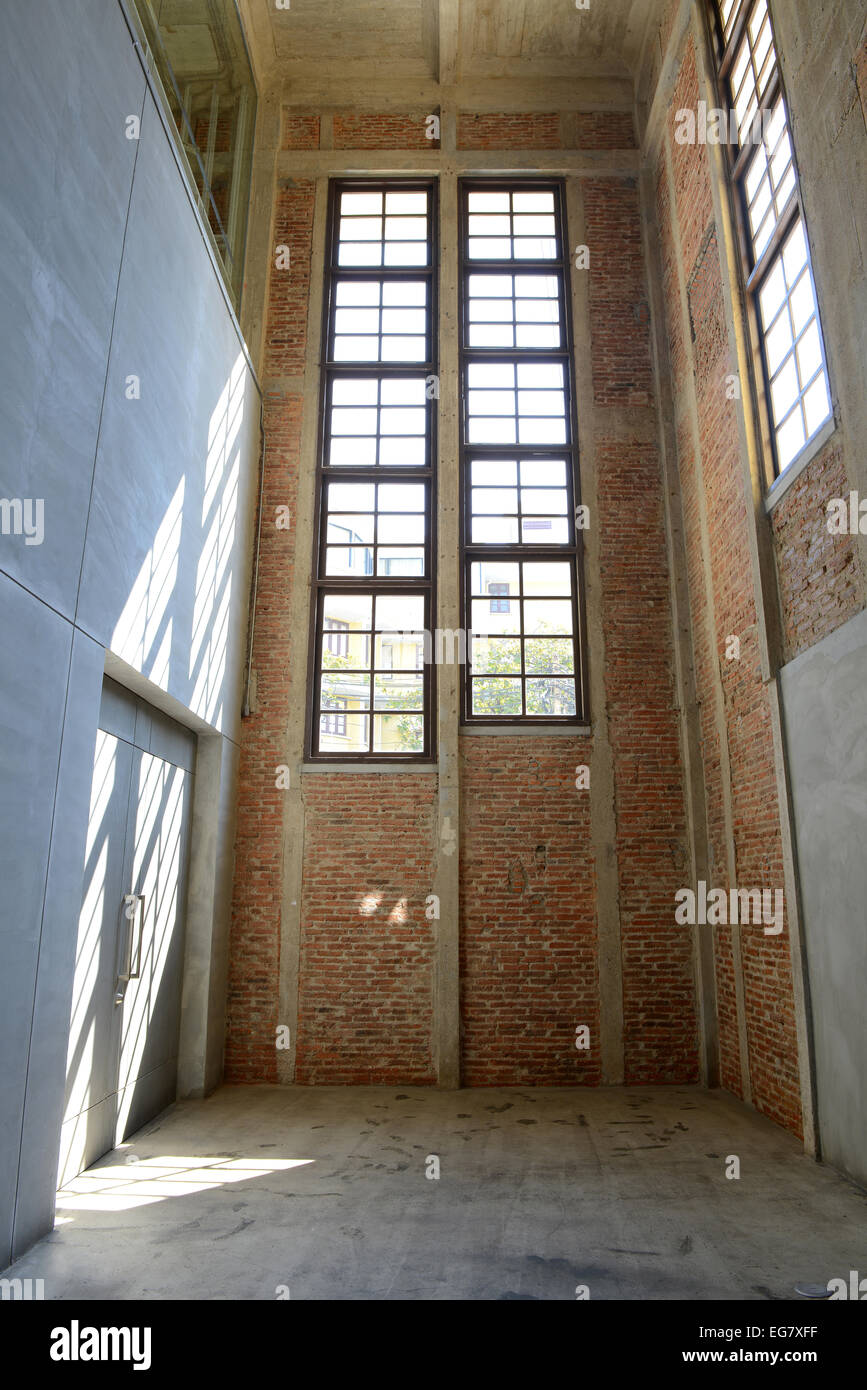 Sunlight from window on the cement walls and floor inside of old ...