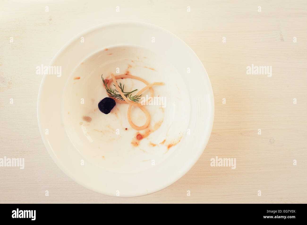 Empty plate after eaten pasta Stock Photo - Alamy