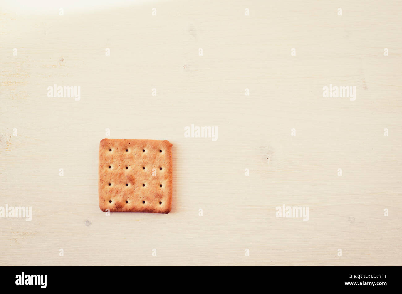 Cracker one on a white table top view Stock Photo - Alamy