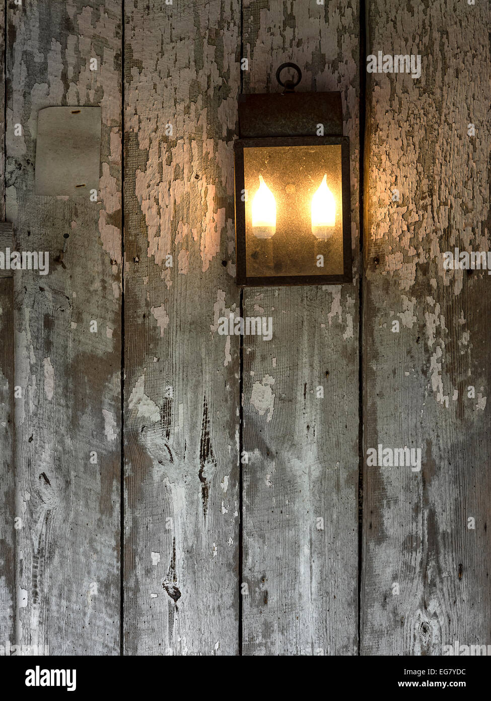 Antique light fixture on a weathered exterior facade Stock Photo - Alamy