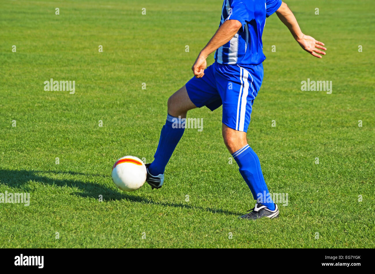 Soccer player with a ball Stock Photo - Alamy