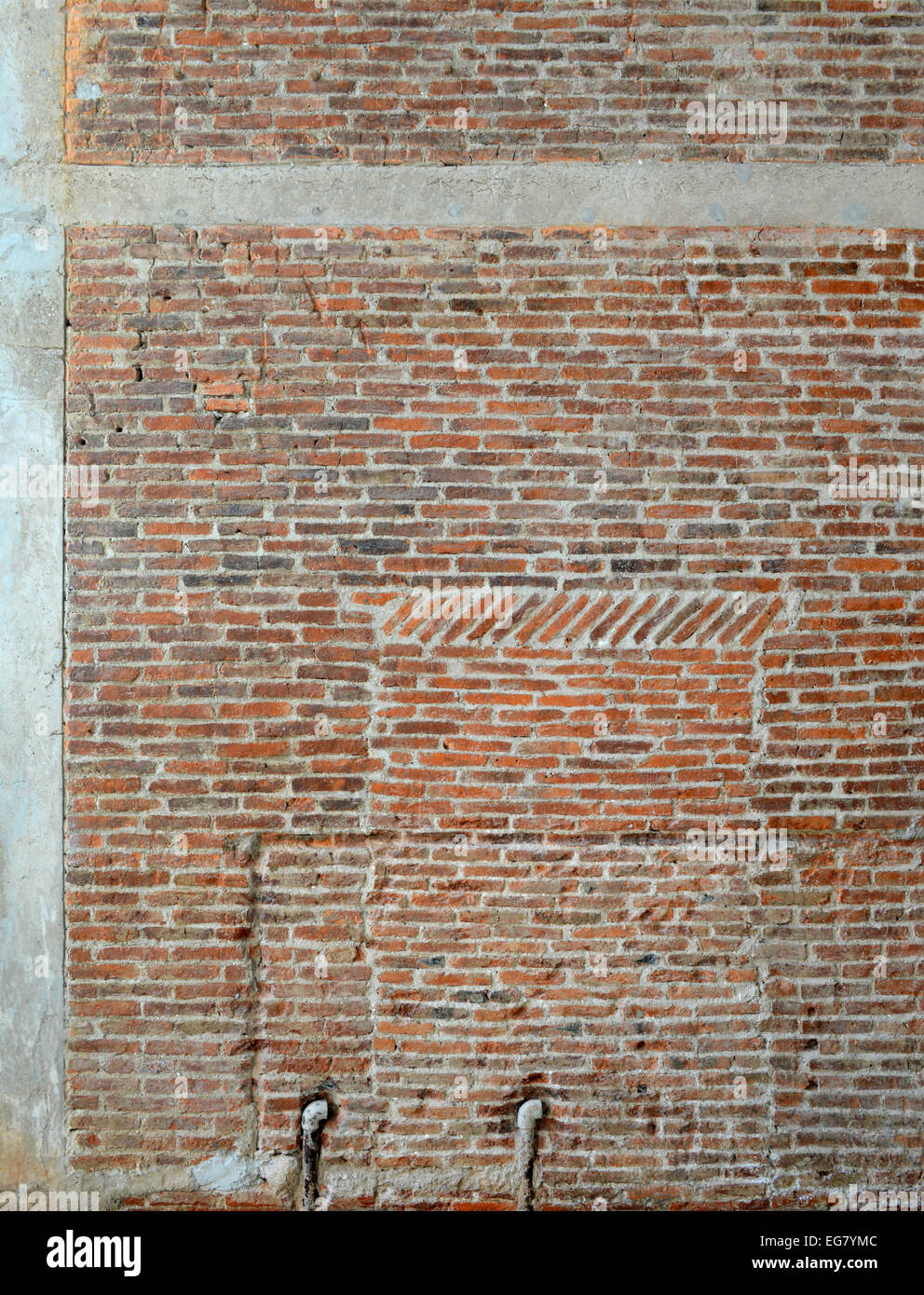 Old brick wall and pipe on concrete texture, background for decorate ...