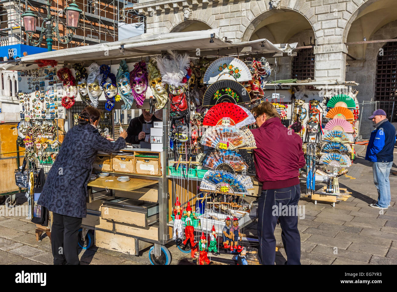 Market stall holder in St Marks Square, Venice, Italy Stock Photo - Alamy