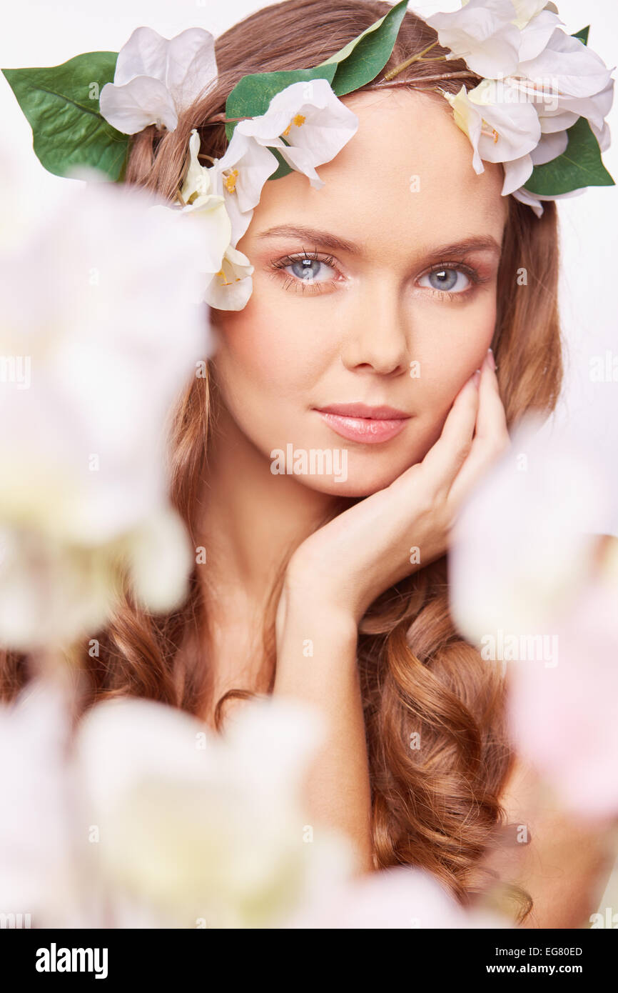 Pretty woman in floral wreath expressing calmness Stock Photo - Alamy
