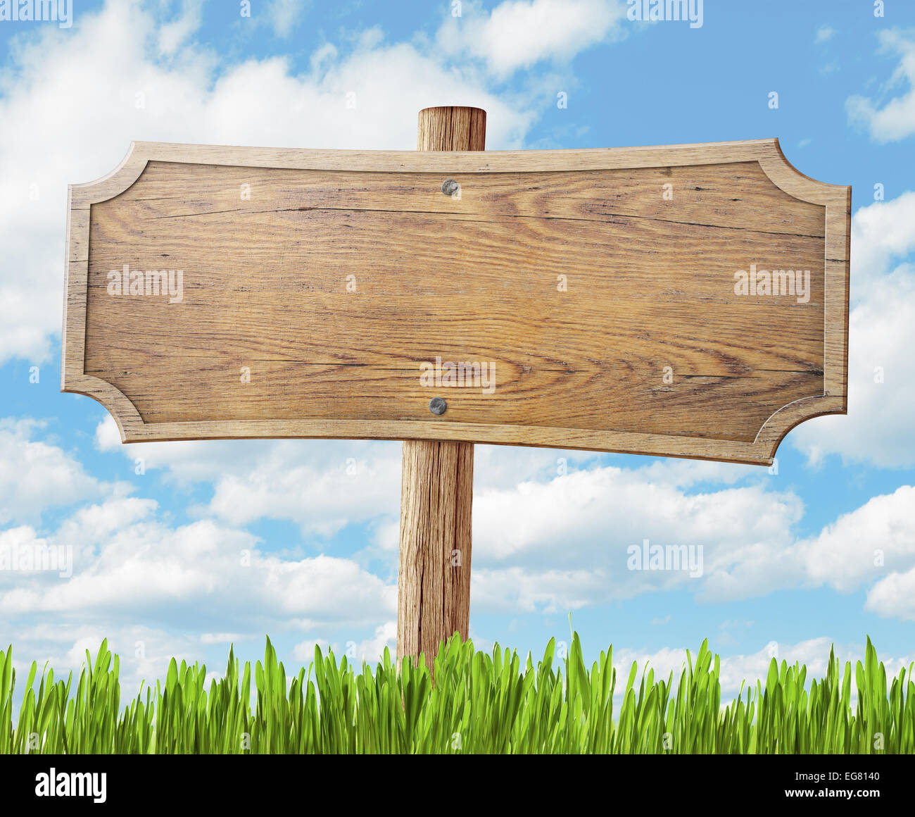 wood road sign on grass and sky background Stock Photo - Alamy