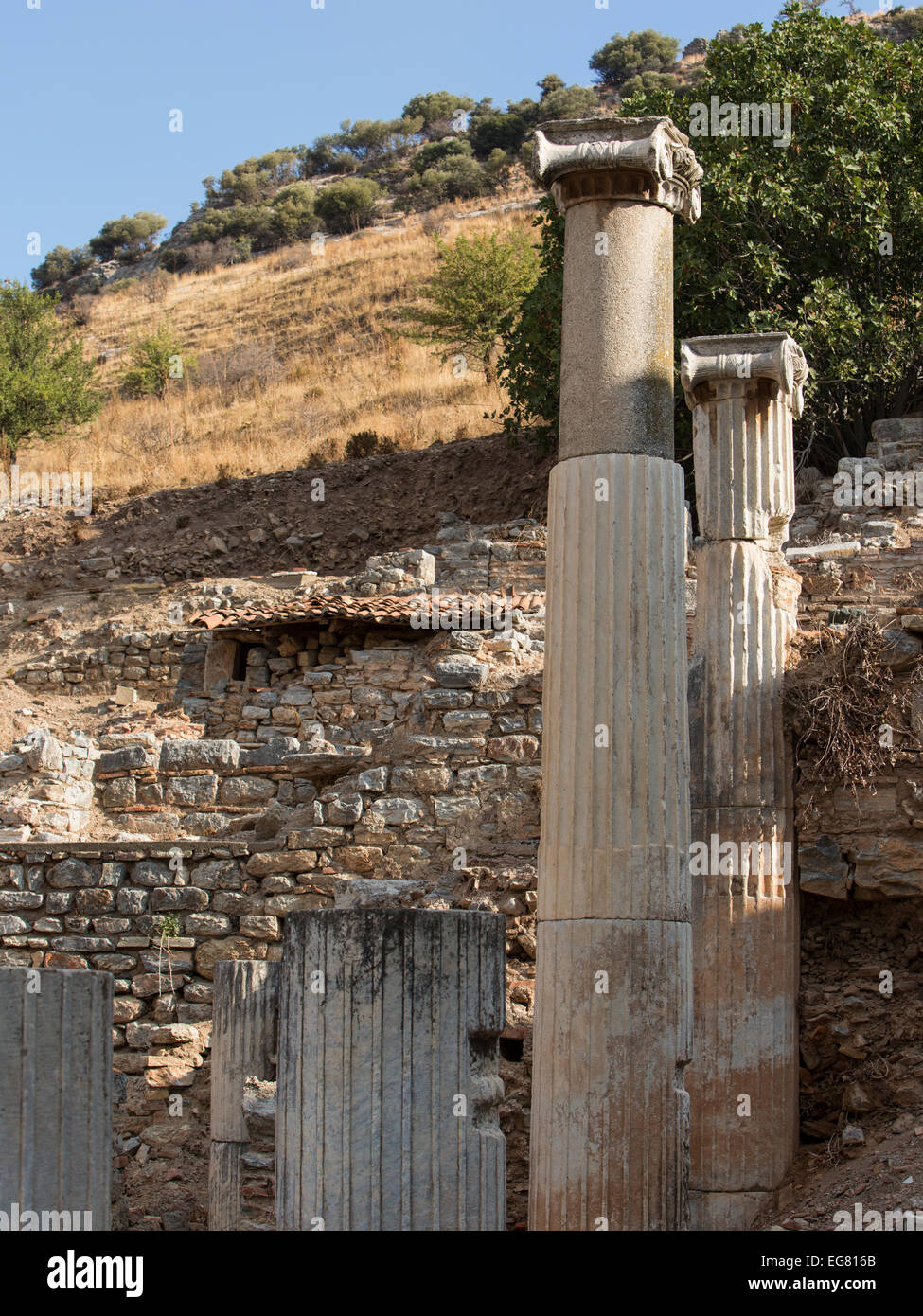 Ancient Ephesus, ruins columns against hill Stock Photo - Alamy