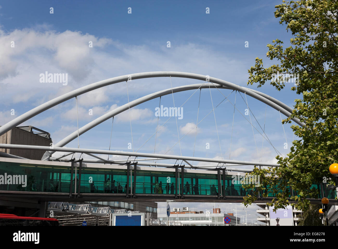 Sky bridge at Heathrow Airport, London England. Anonymous passengers ...