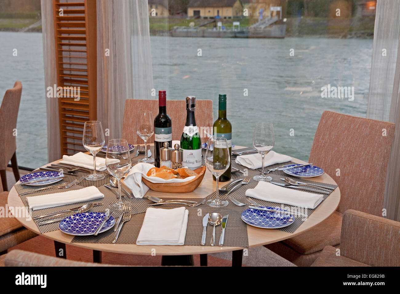 A table set for dinner on board Viking Hlin River cruise ship Stock ...