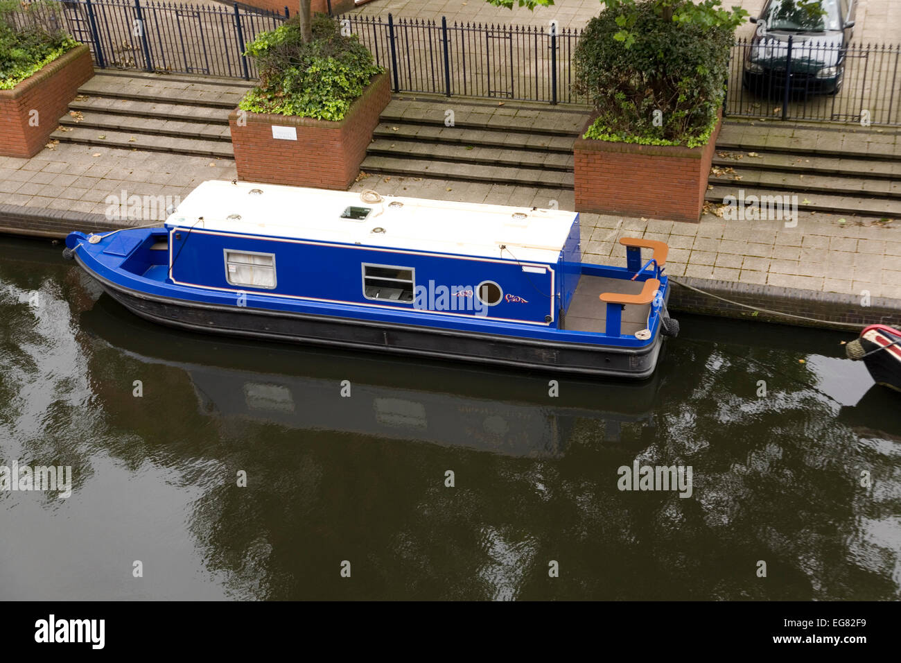 Small blue houseboat moored on the Birmingham canal Stock Photo - Alamy