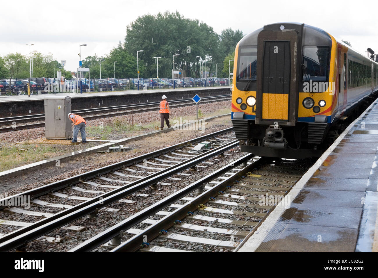 A morning commuter train to London, pulls into Farnborough station in ...
