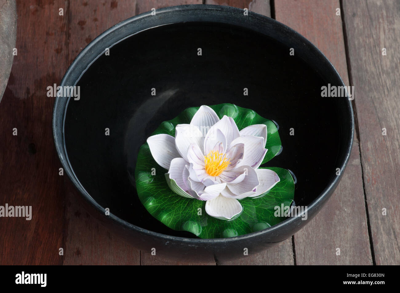 Spa still life with lotus flower and wood Stock Photo - Alamy