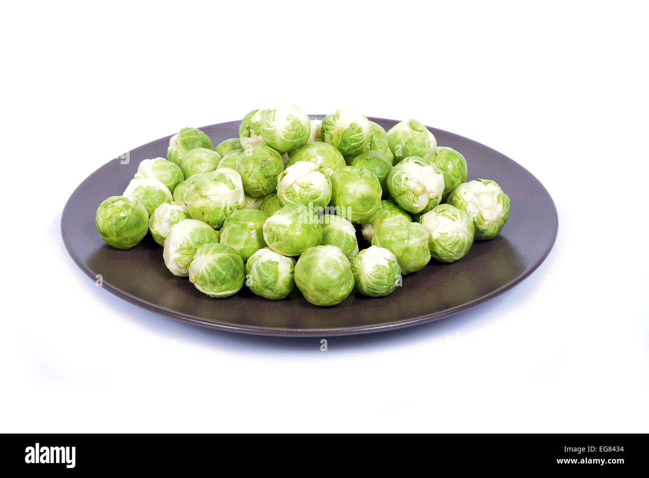 plate of brussels sprouts on the white background Stock Photo - Alamy