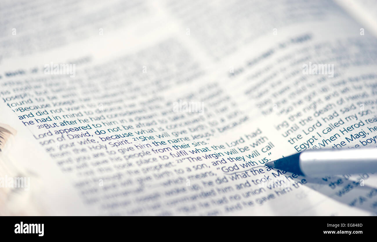 Detail closeup zoom God with us scripture in bible verse Stock Photo ...