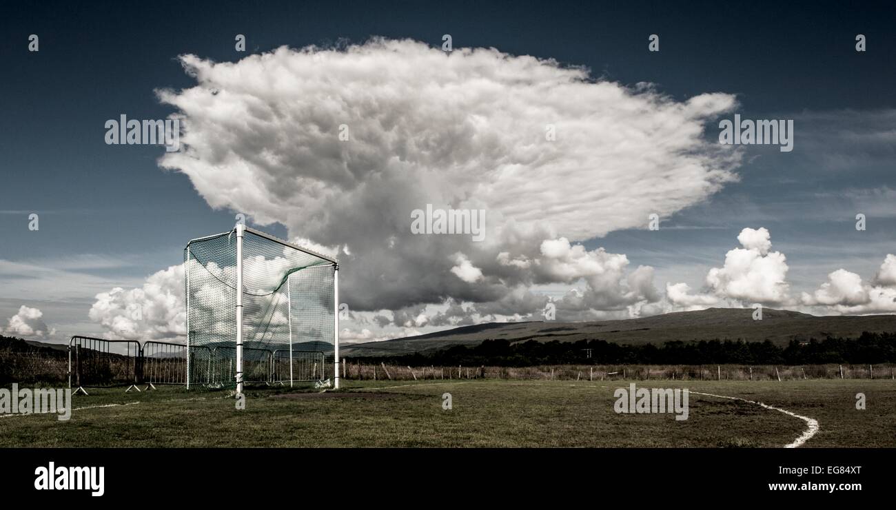 A storm cloud forms above a Highland shinty pitch near Fort William ...