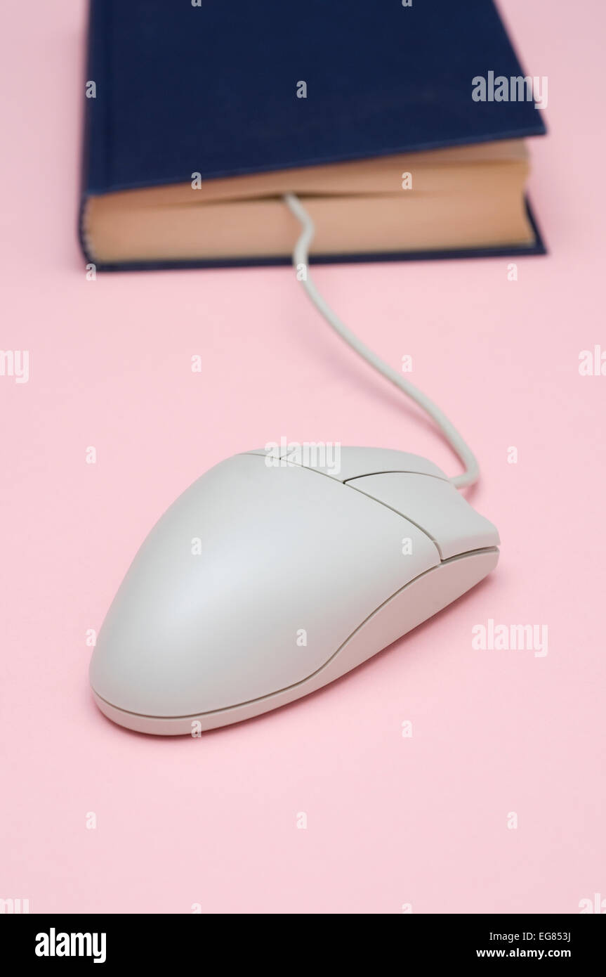 Computer mouse wire used as bookmark in book Stock Photo - Alamy