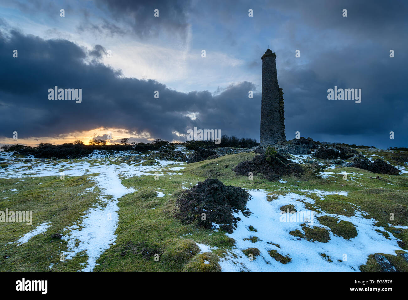 Storm clouds gather over an abandoned chimney stack left over from ...