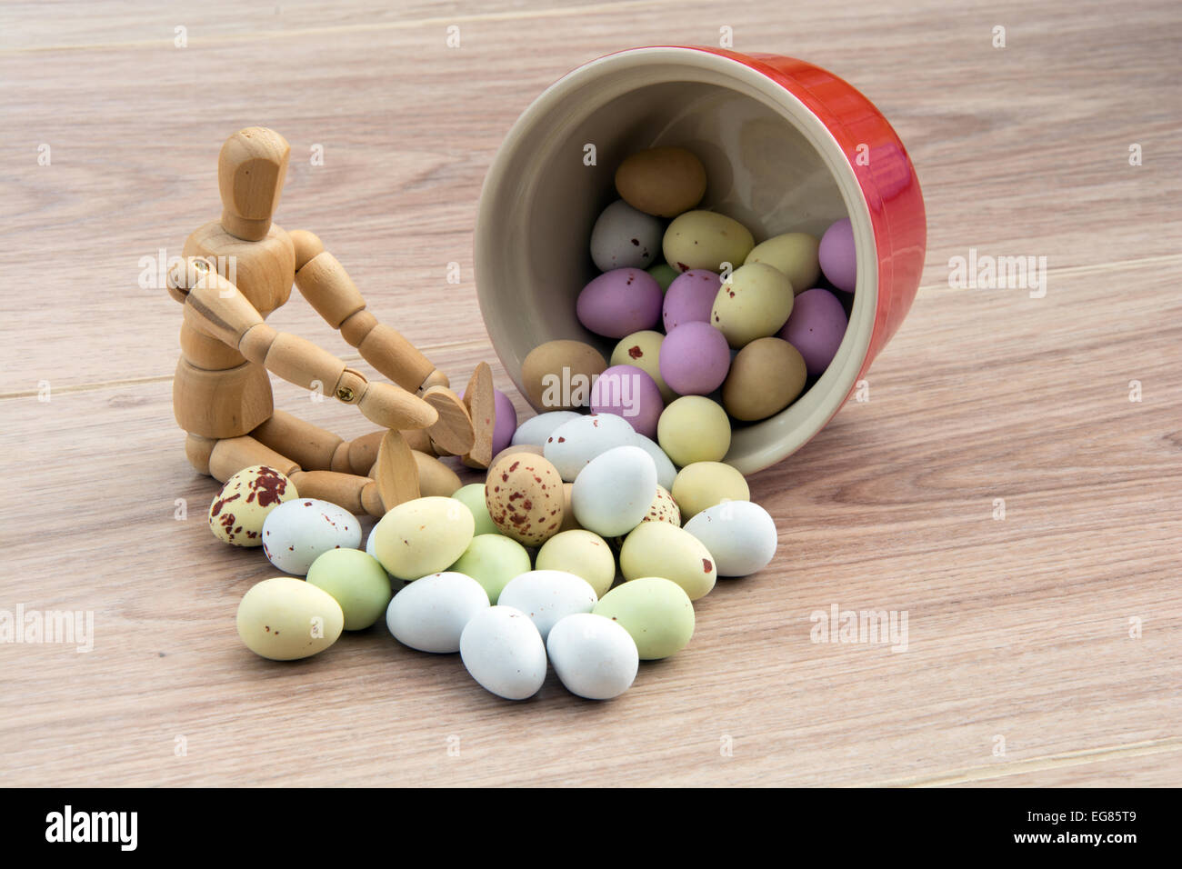 Easter eggs spilling from a small dish Stock Photo - Alamy