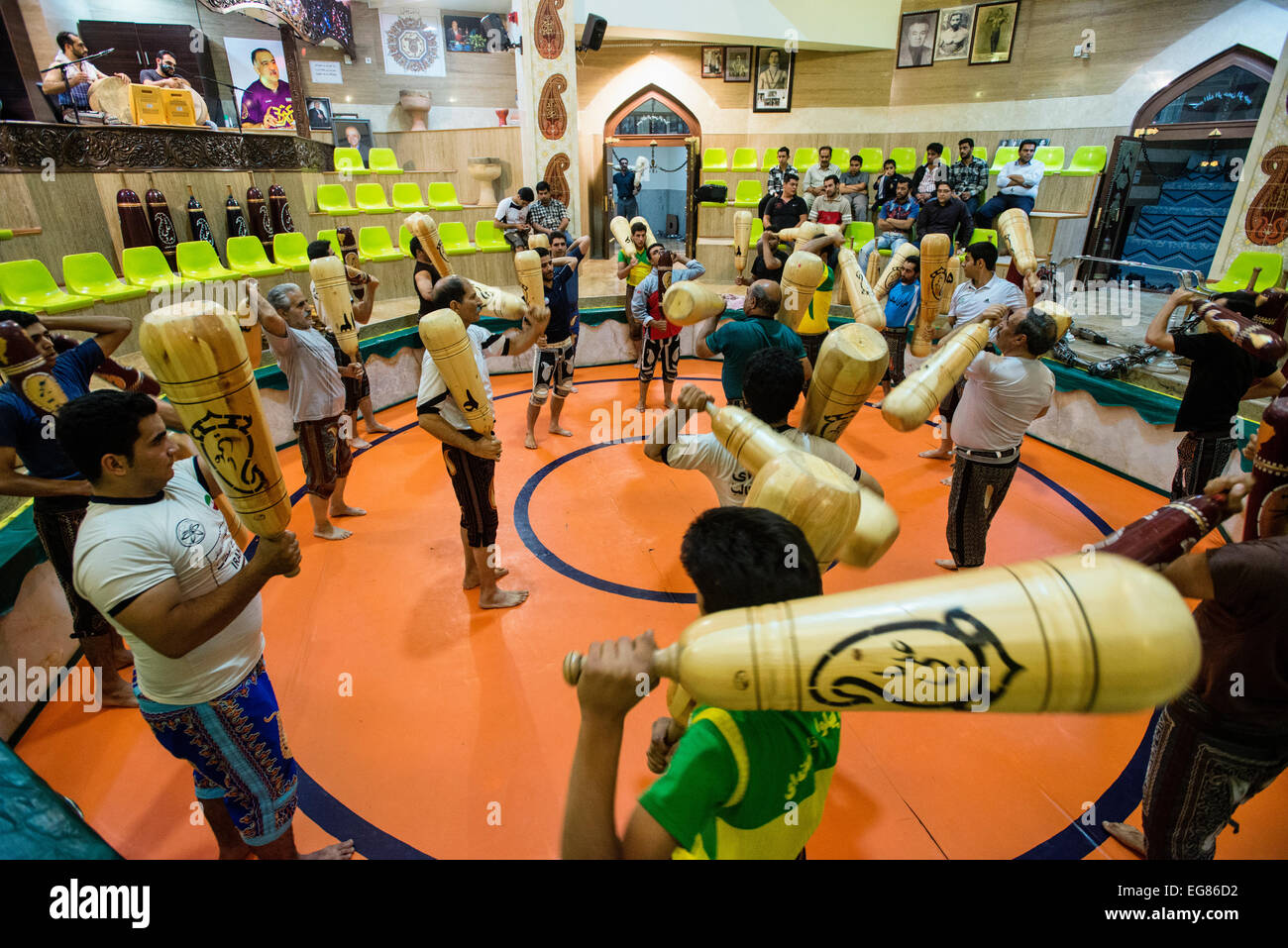 Wrestlers training with meels, wooden clubs with weight from 9 to 18 ...