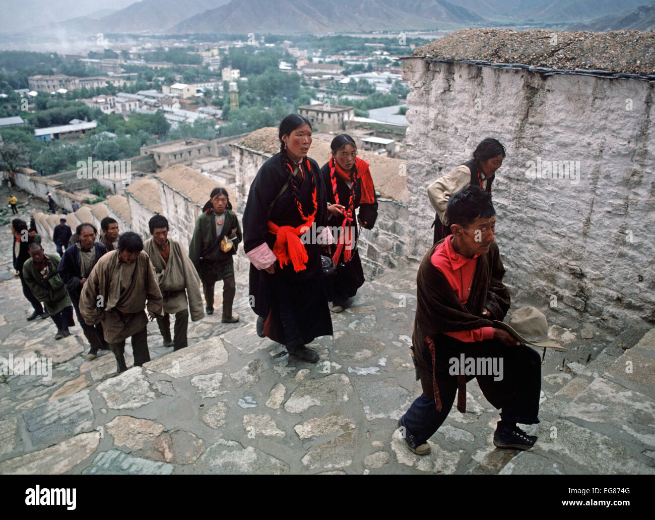 Buddhist pilgrims visiting Potala Palace, Lhasa, was chief residence of ...