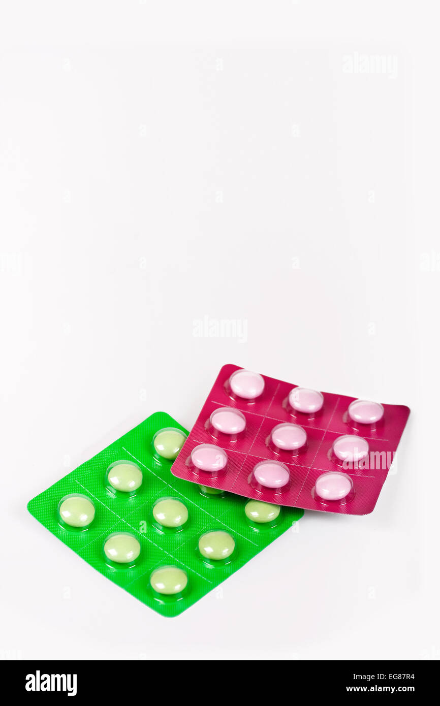 Two kinds of pills on a white background Stock Photo - Alamy