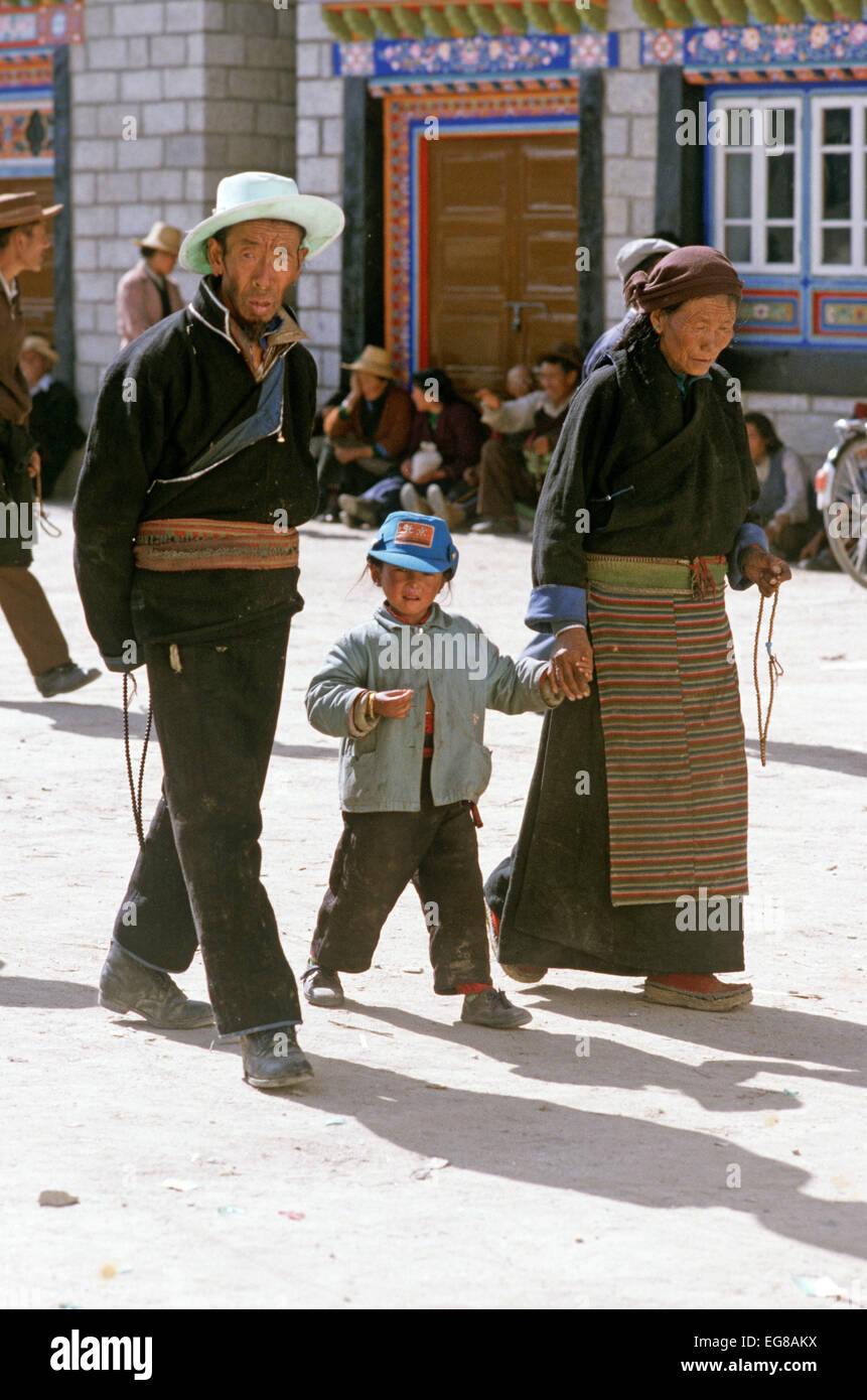 Tibetan family in Lhasa main square, Tibet, Autonomous Region, China ...