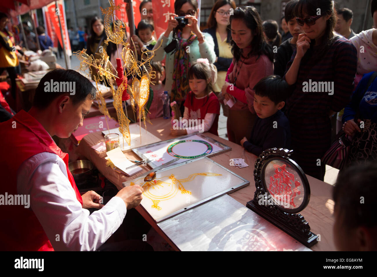 Taichung, China's Taiwan. 19th Feb, 2015. Folk artist Liu Shengli draws ...