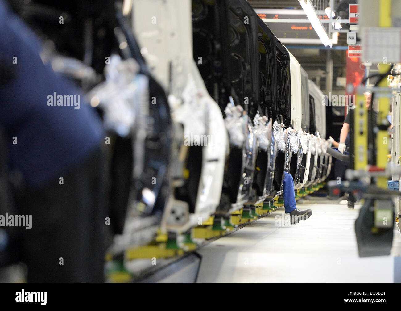 Employees are busy at work on the production line for a Mercedes S ...